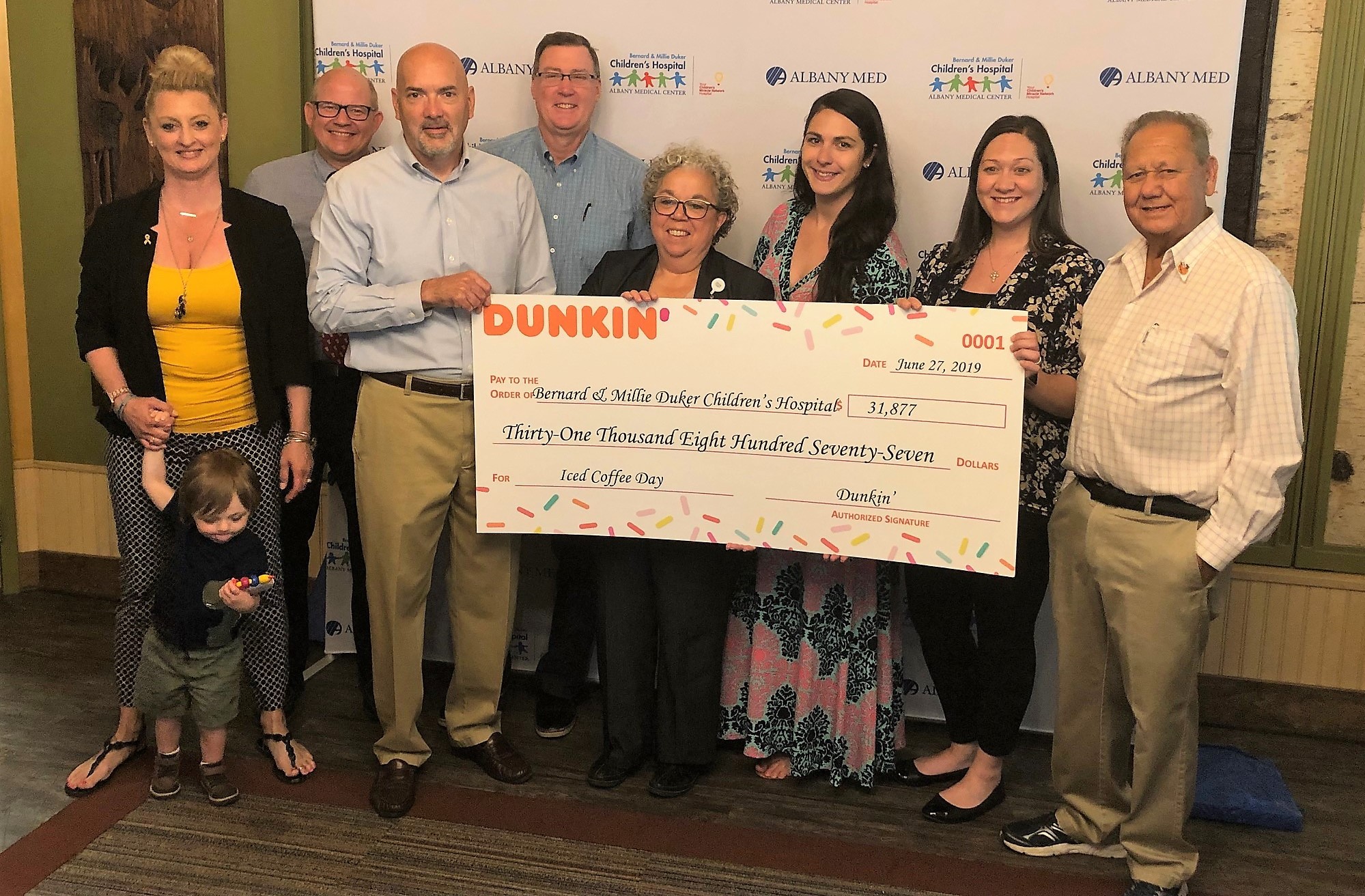 DUNKIN’ DONATES NEARLY ,000 - Ed Lewi and Associates